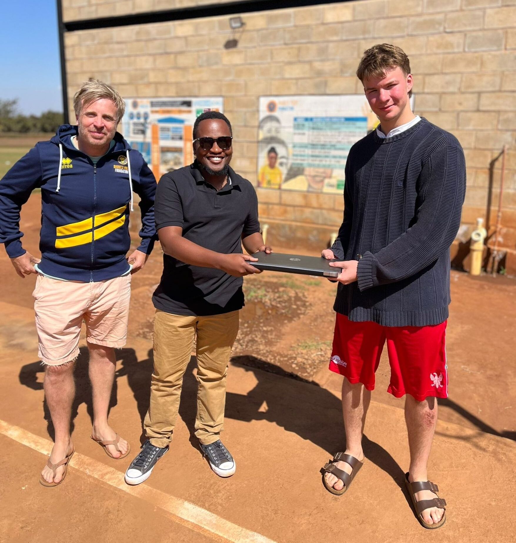 Donating laptops to Bhubesi Pride Foundation in Malawi - Robinson & Hall